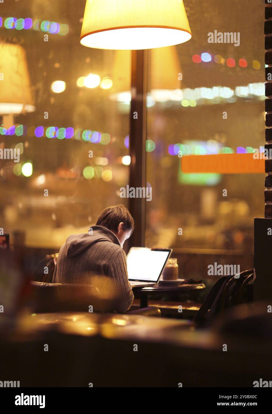 Blurred man with laptop at cafe background, business, technology ...
