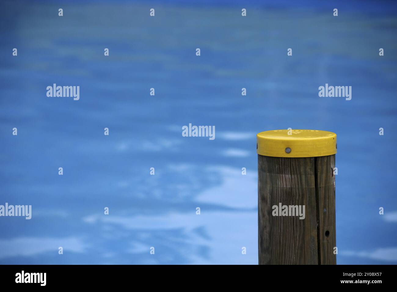 Post at the edge of a swimming pool Stock Photo - Alamy
