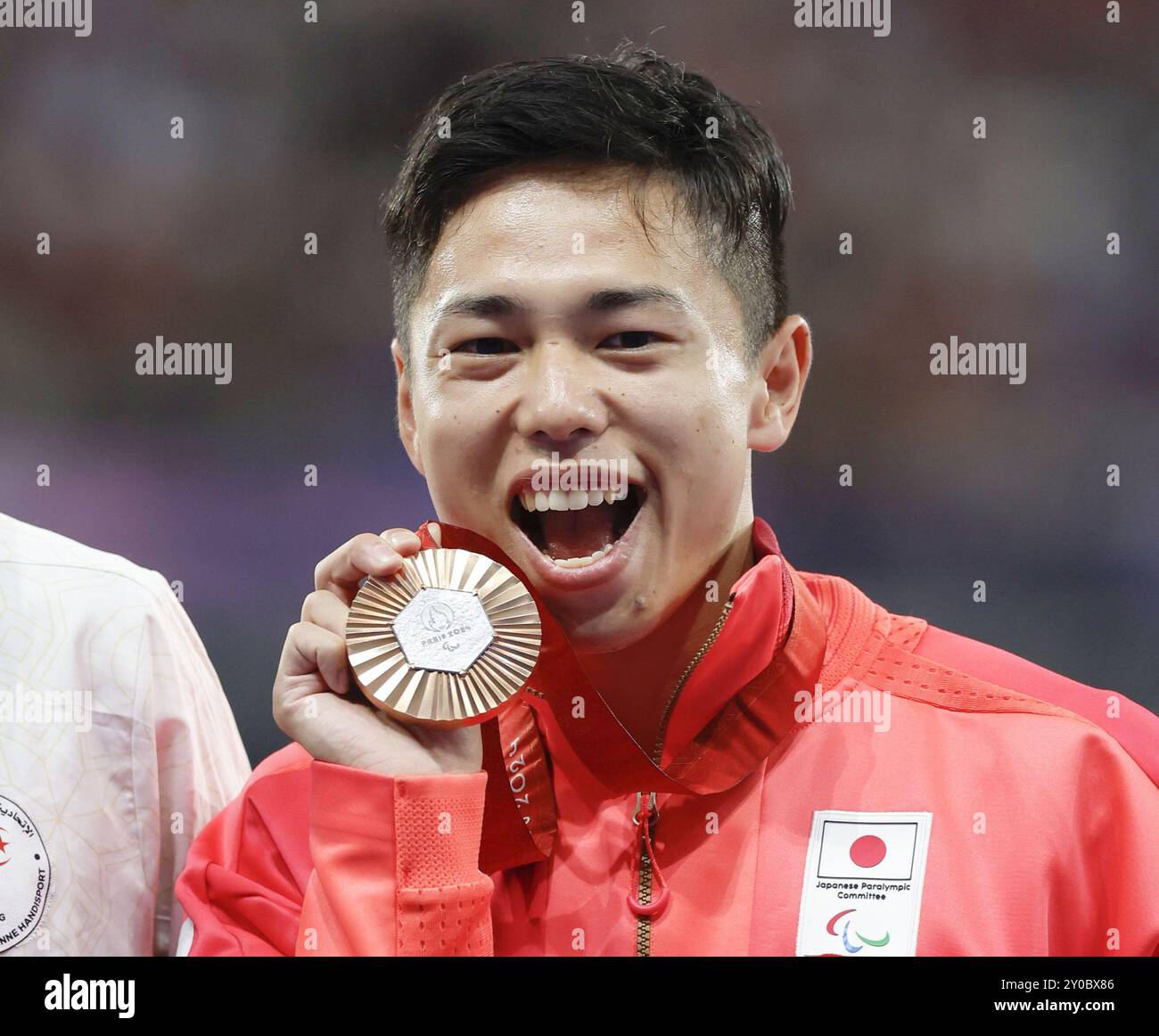 Shuta Kawakami of Japan poses with his bronze medal for the men's T13 ...