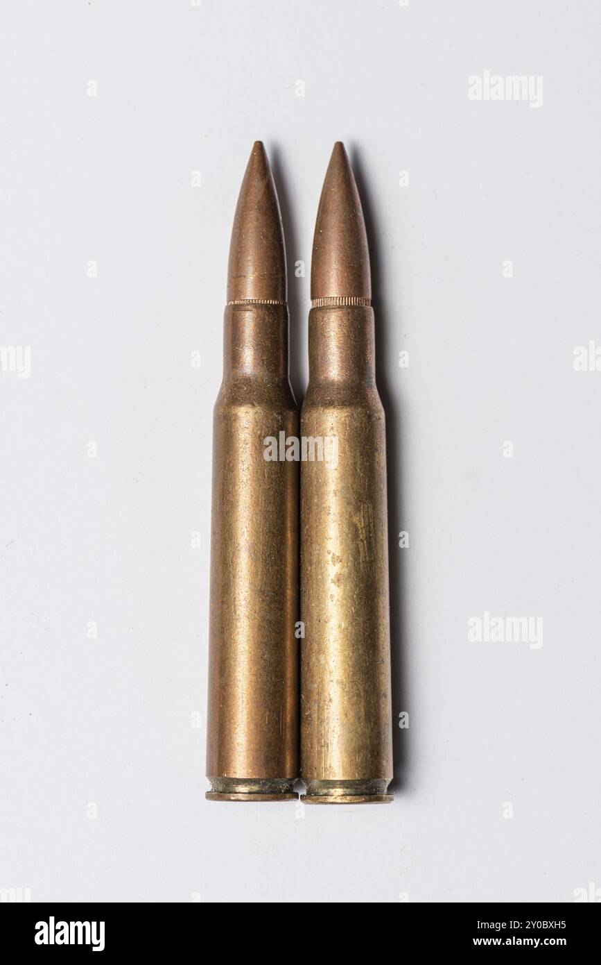 Two rifle bullets on white background Stock Photo - Alamy