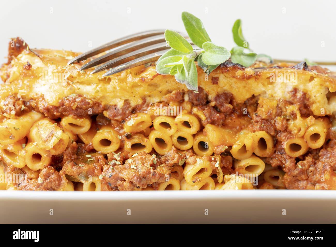 Greek pastizio pasta dish with cheese Stock Photo - Alamy