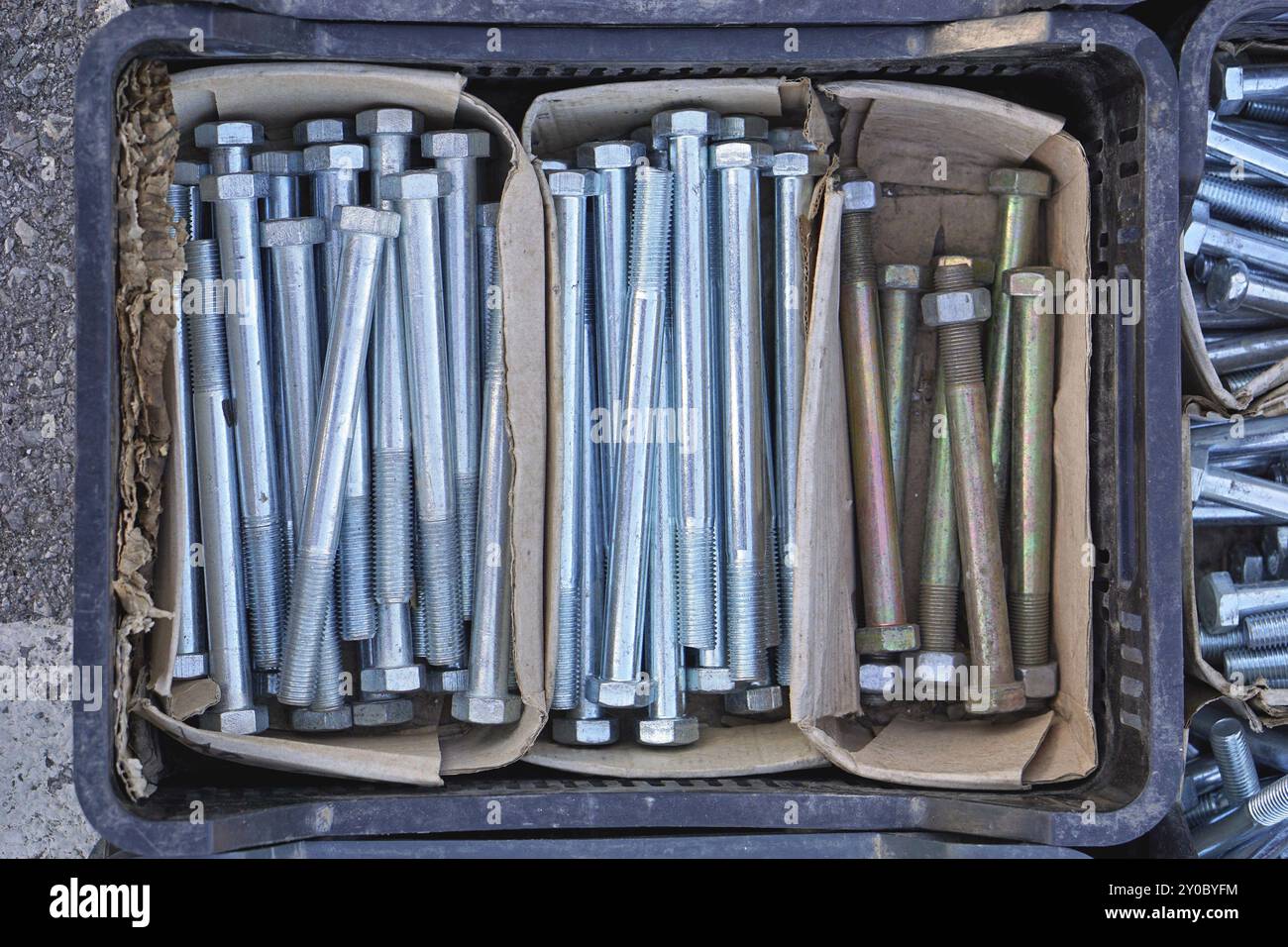 New long screws in boxes Stock Photo - Alamy