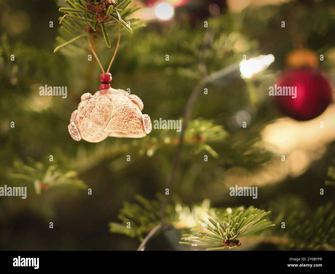 Christmas. Christmas decoration. Casing of a snail spoiled with glitter ...