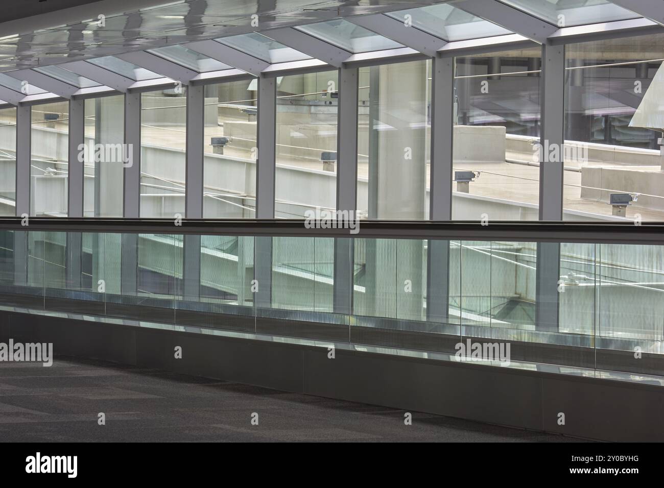 Modern building with large glass windows and structured architectural ...