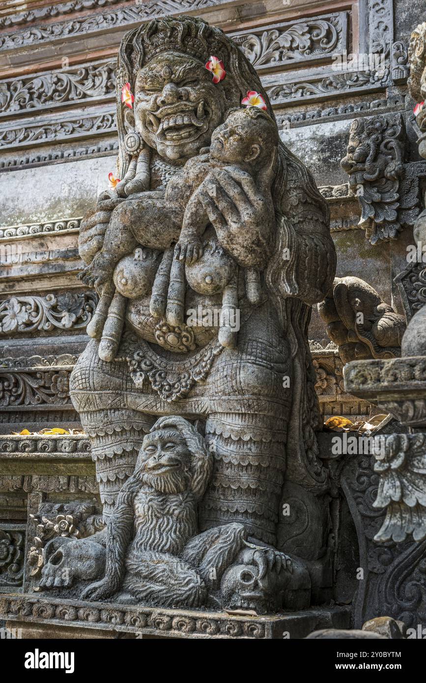 Female temple figure with child and monkey, Hinduism, tradition, Bali ...