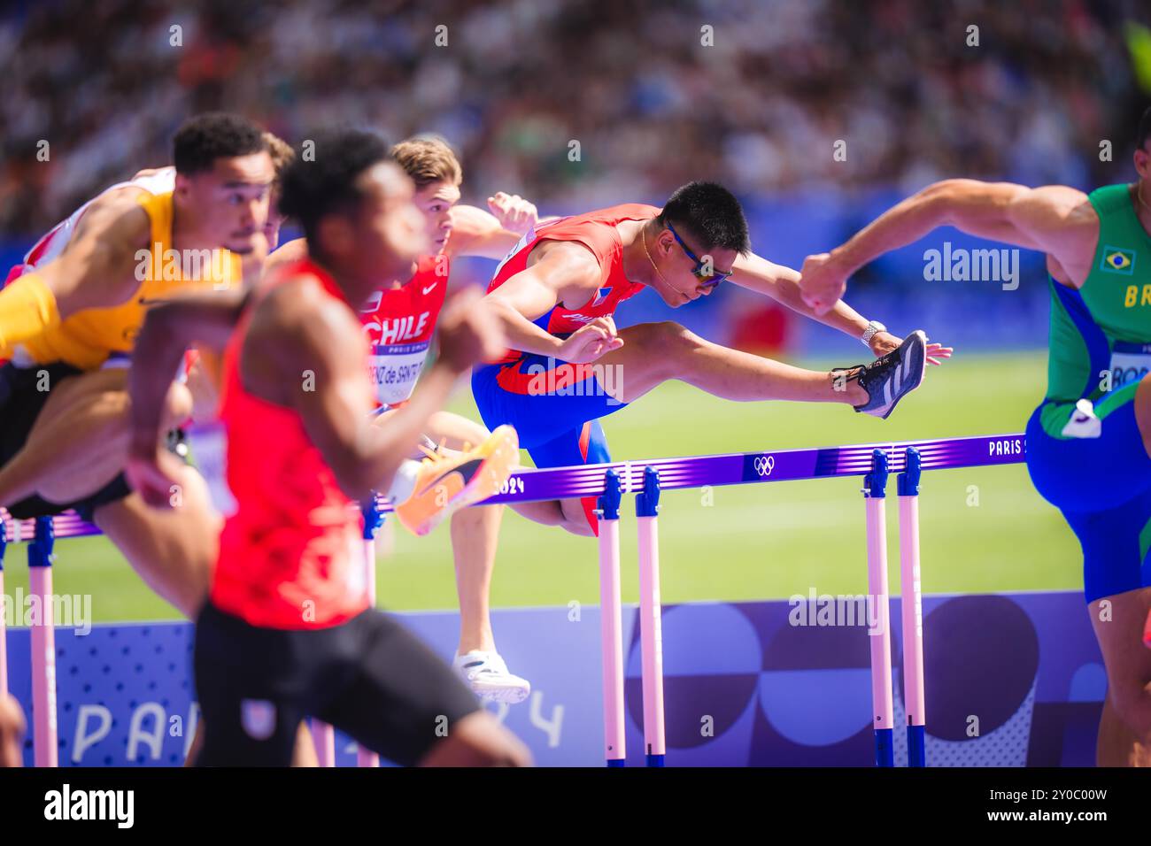 John Cabang participating in the 110 meters hurdles at the Paris 2024 ...