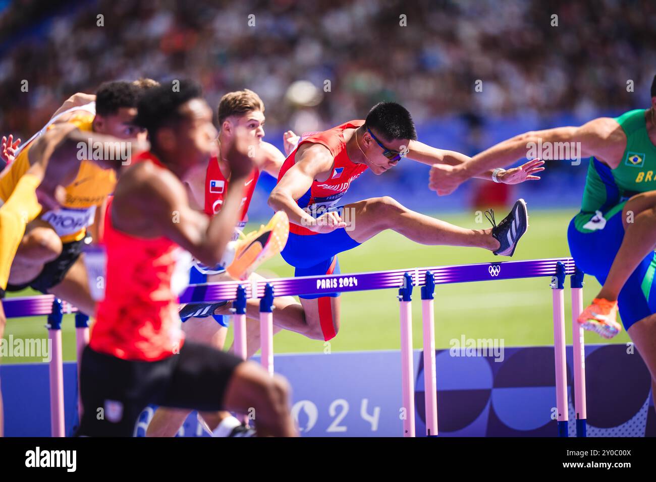 John Cabang participating in the 110 meters hurdles at the Paris 2024 ...