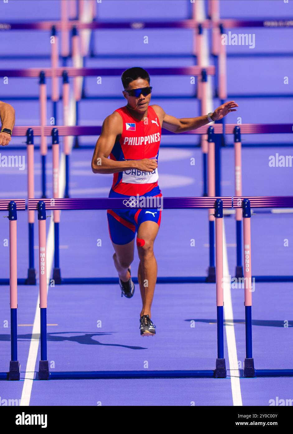 John Cabang participating in the 110 meters hurdles at the Paris 2024 ...