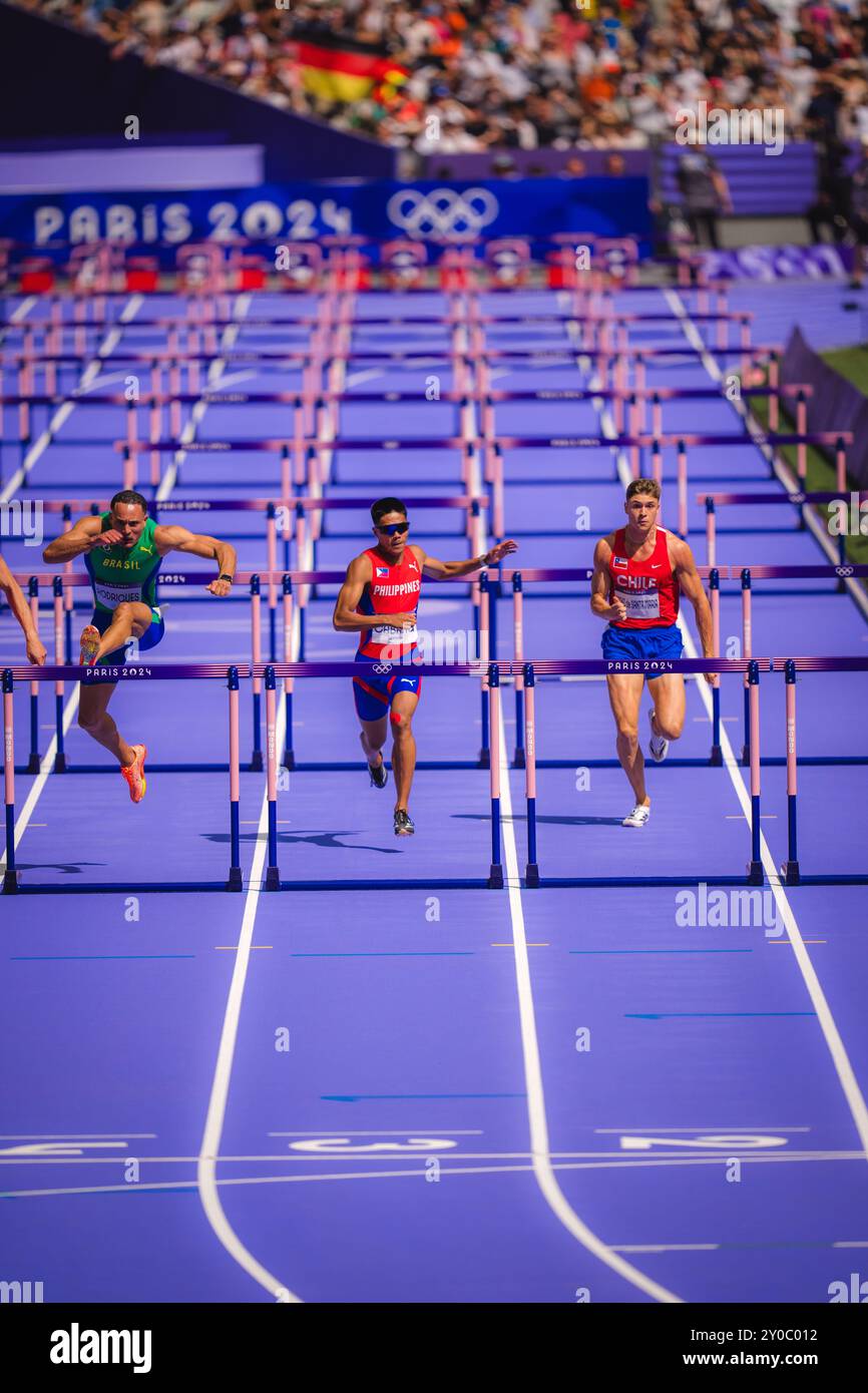 John Cabang participating in the 110 meters hurdles at the Paris 2024 ...