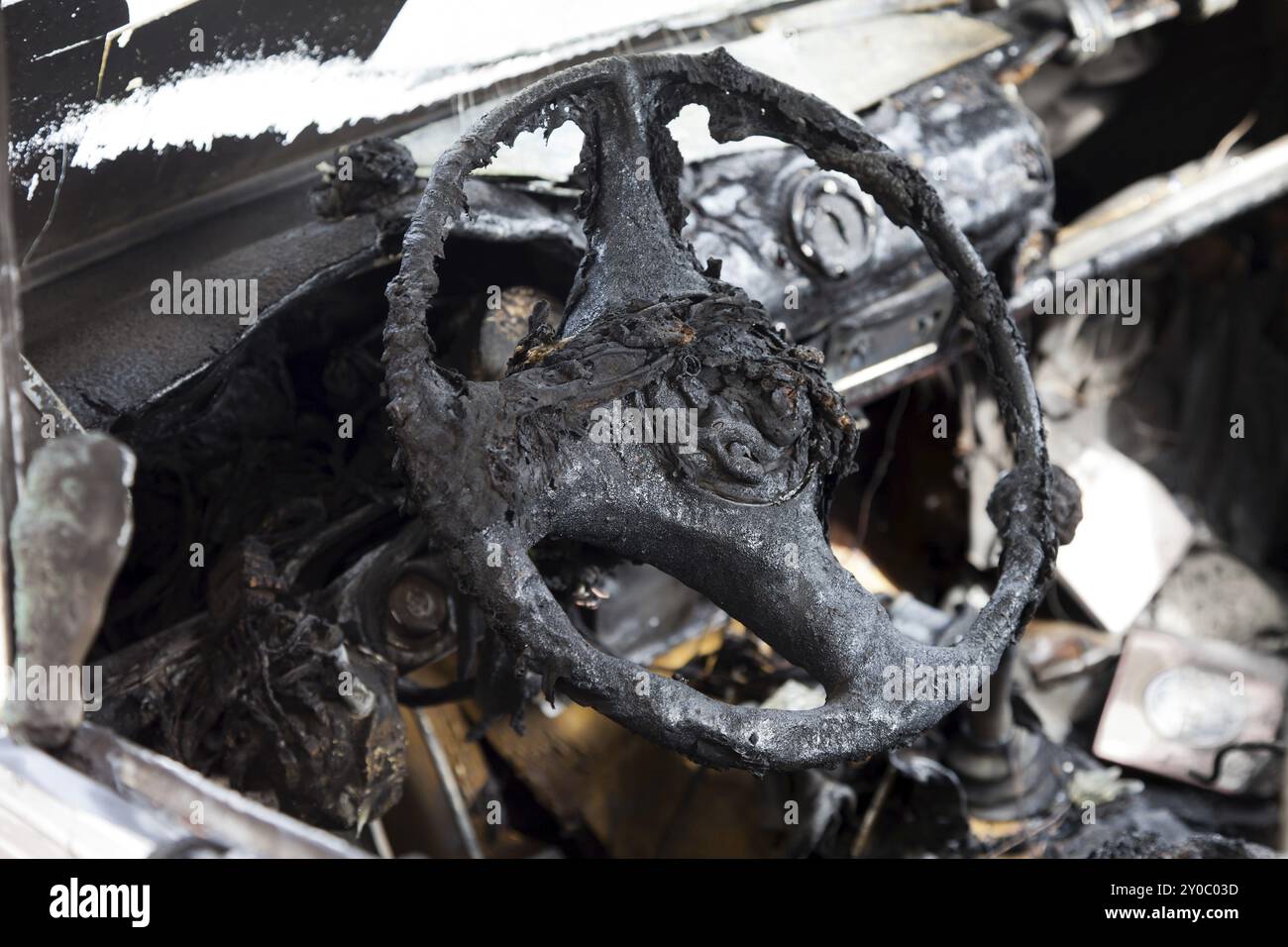 Wreck accident fire burnt wheel car vehicle junk Stock Photo - Alamy