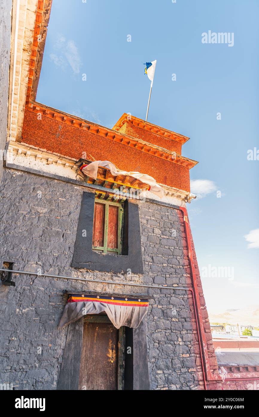 Explore the iconic red, gray, and white facade of Sakya Monastery in ...