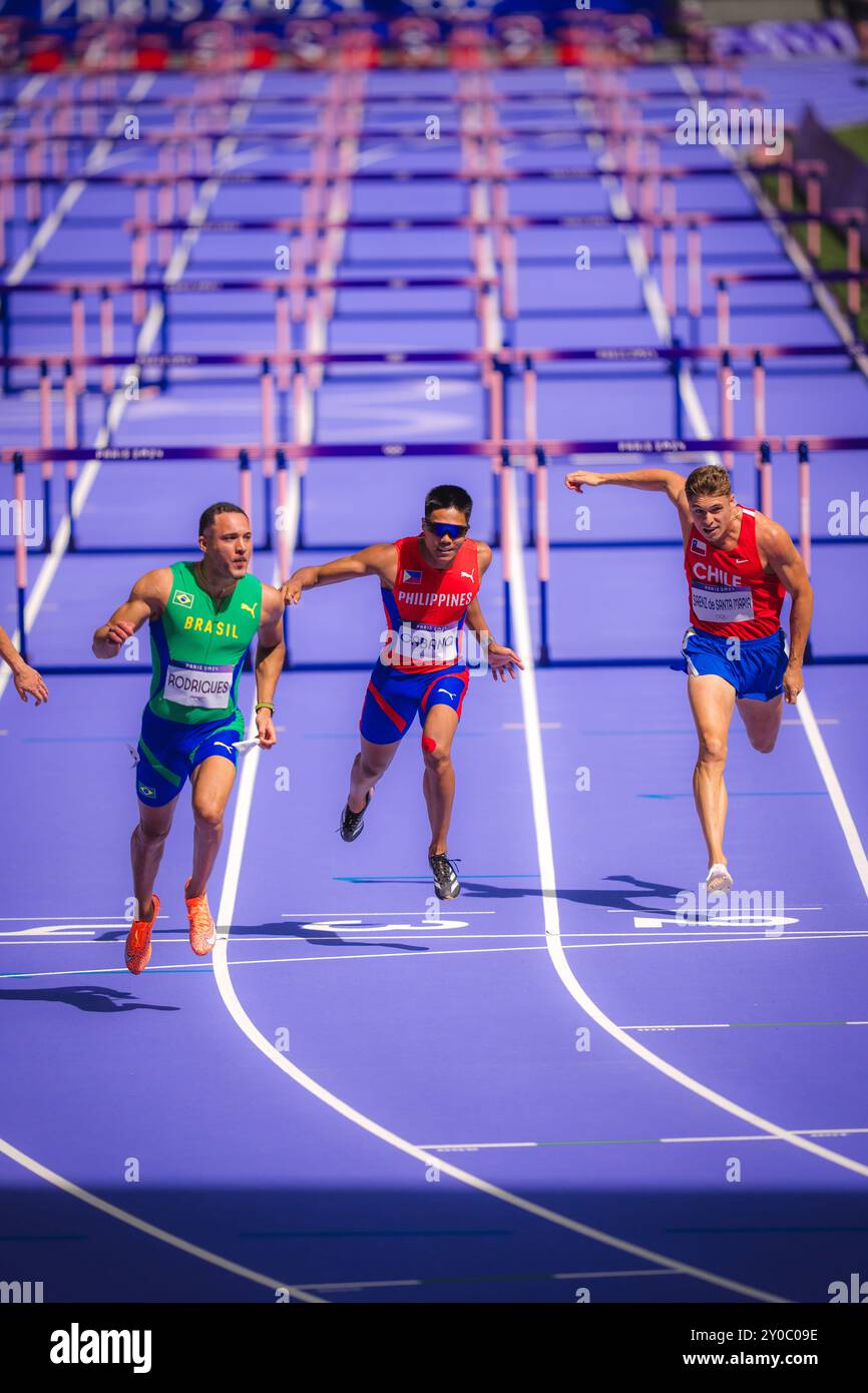 John Cabang participating in the 110 meters hurdles at the Paris 2024 ...