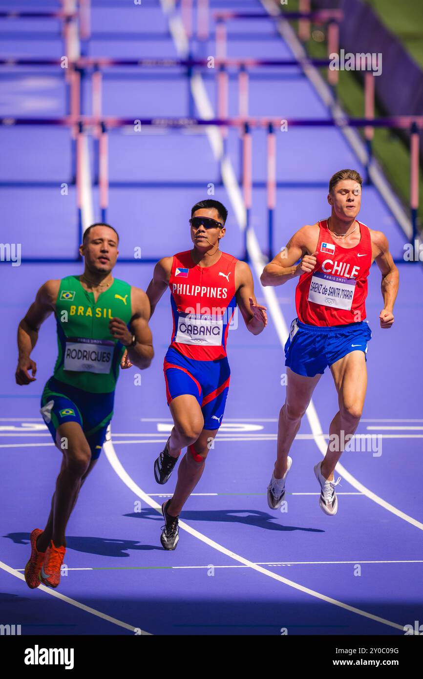 John Cabang participating in the 110 meters hurdles at the Paris 2024 ...