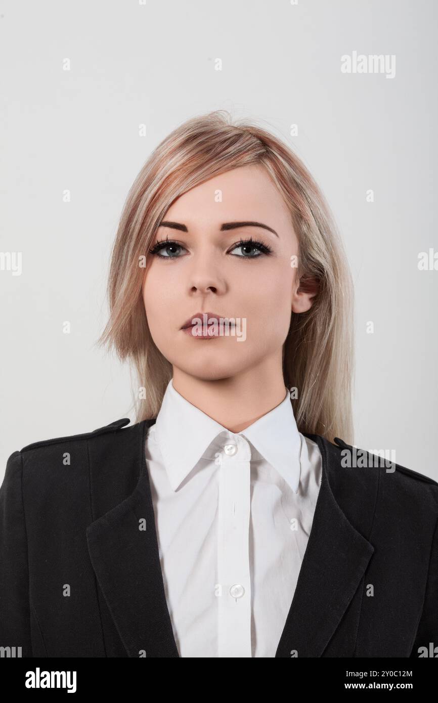 Confident young businesswoman in a stylish suit and white shirt exudes professionalism and ...