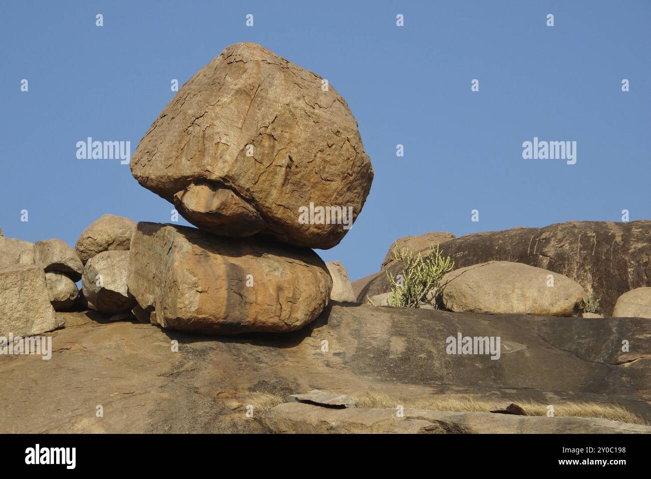 Big balancing granite boulder in Hampi, India. Popular area for ...