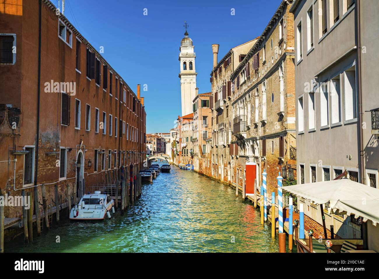 View of canal with old colorful brick houses in Venice, Italy, Europe ...