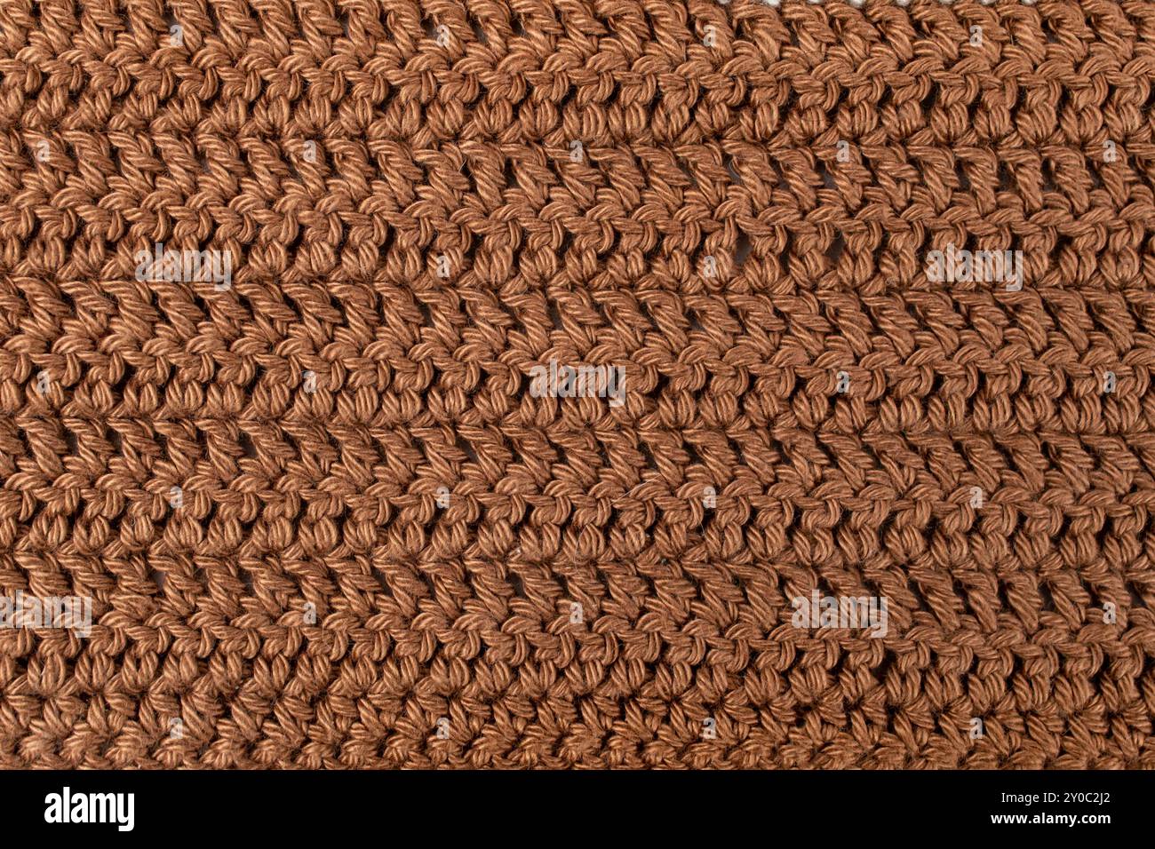 Hand made crochet pattern, textured brown abstract background, with ...