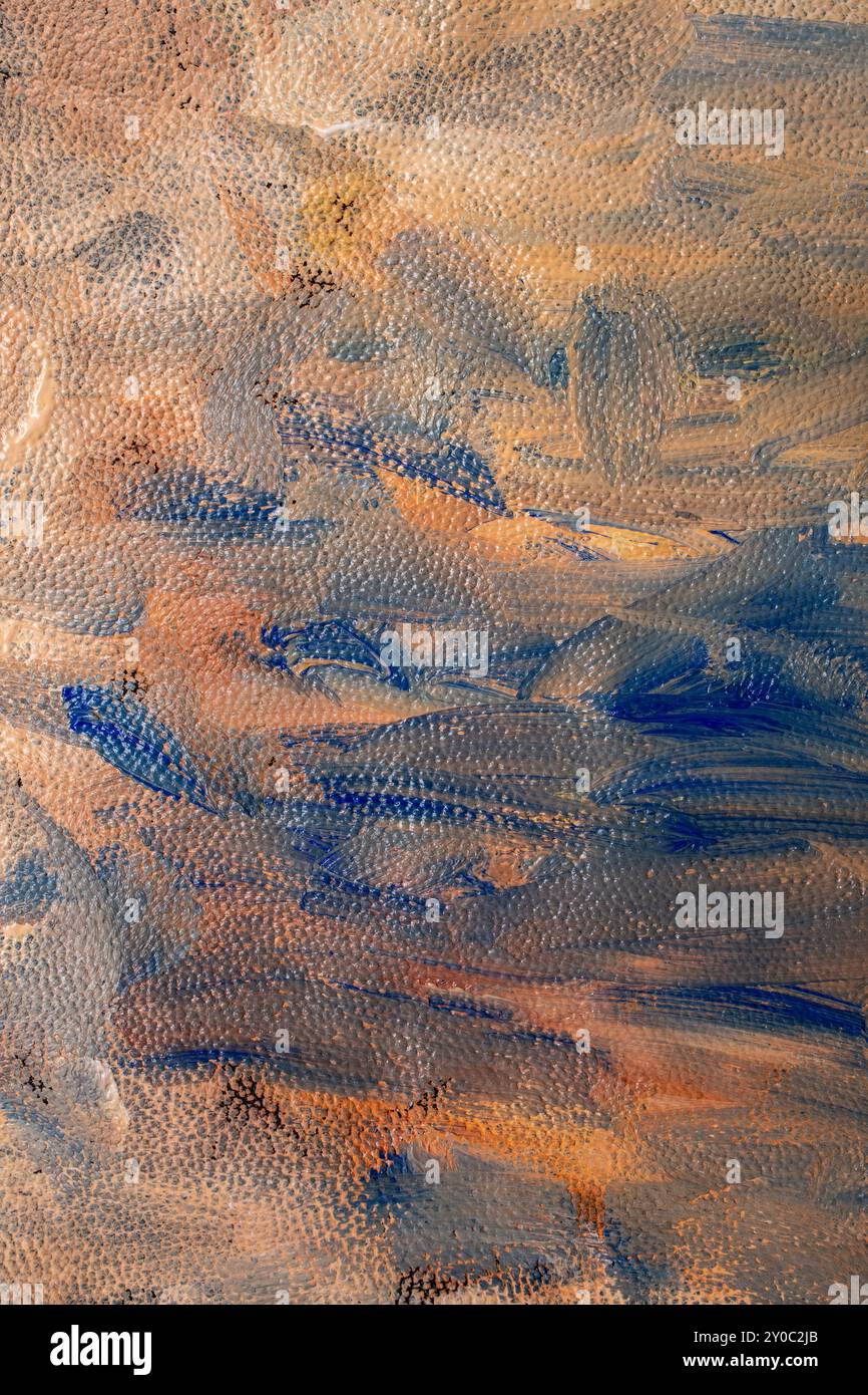 Random acrylic paint , blue, orange and beige smudges on leather ...