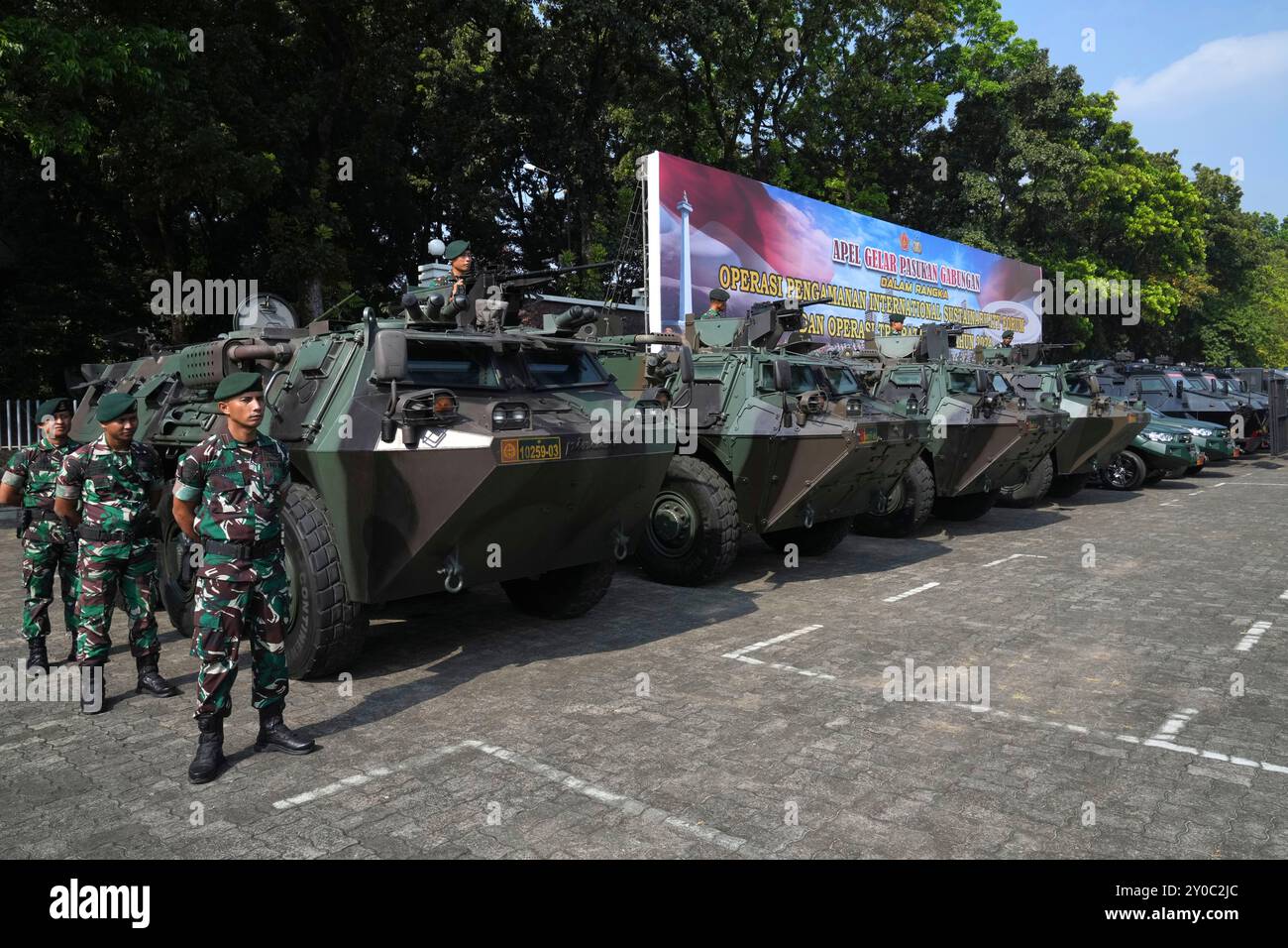 Soldiers stand guard near army vehicle during a show of force ahead of ...