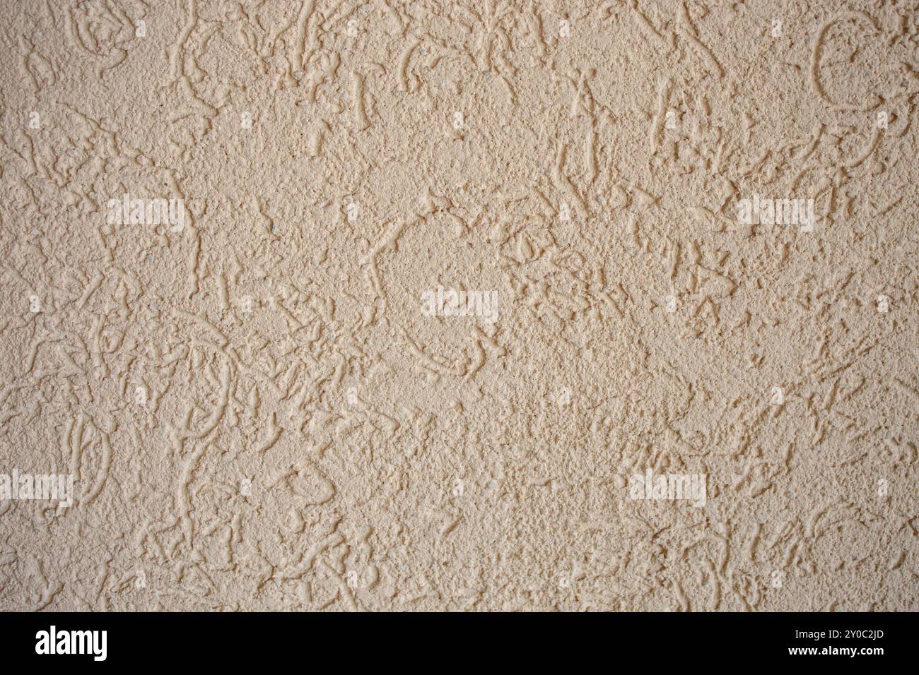 Abstract grained stucco texture , beige painted cement plaster on a ...