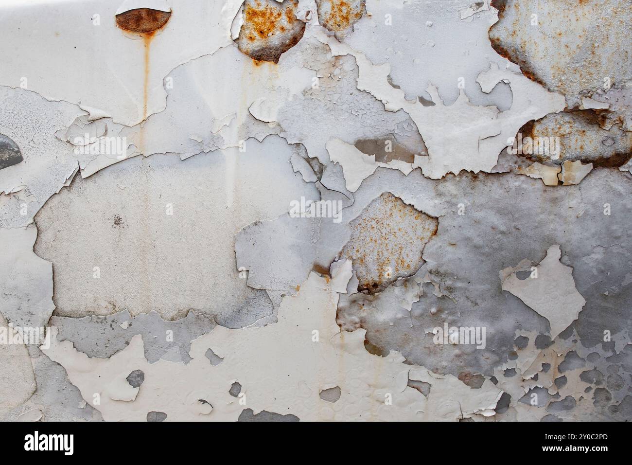 Peeling white paint and rust stains on a abandoned car, close up abstract Stock Photo - Alamy