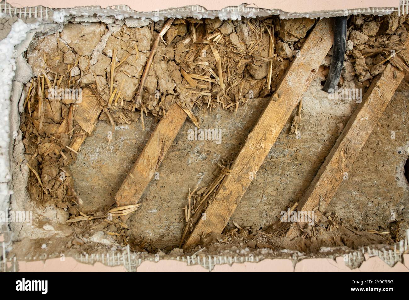 Cement, wood, earth clay, straws and a electric cable inside a rural ...
