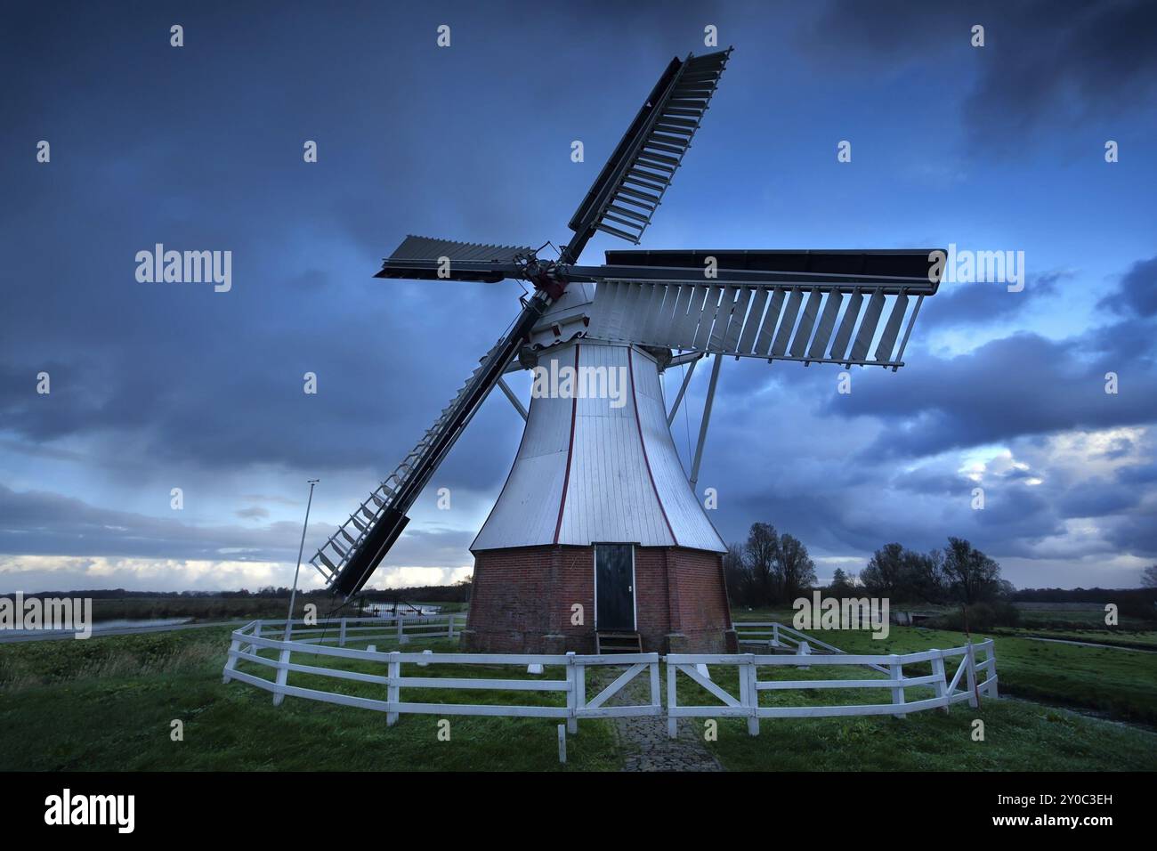 Dutch windmill over storm sky, Holland Stock Photo - Alamy