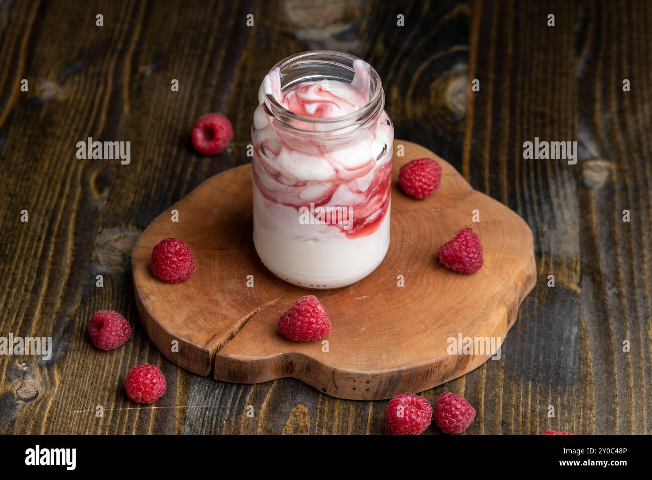 Fresh delicious milk yogurt with raspberry flavor, yogurt with red ...