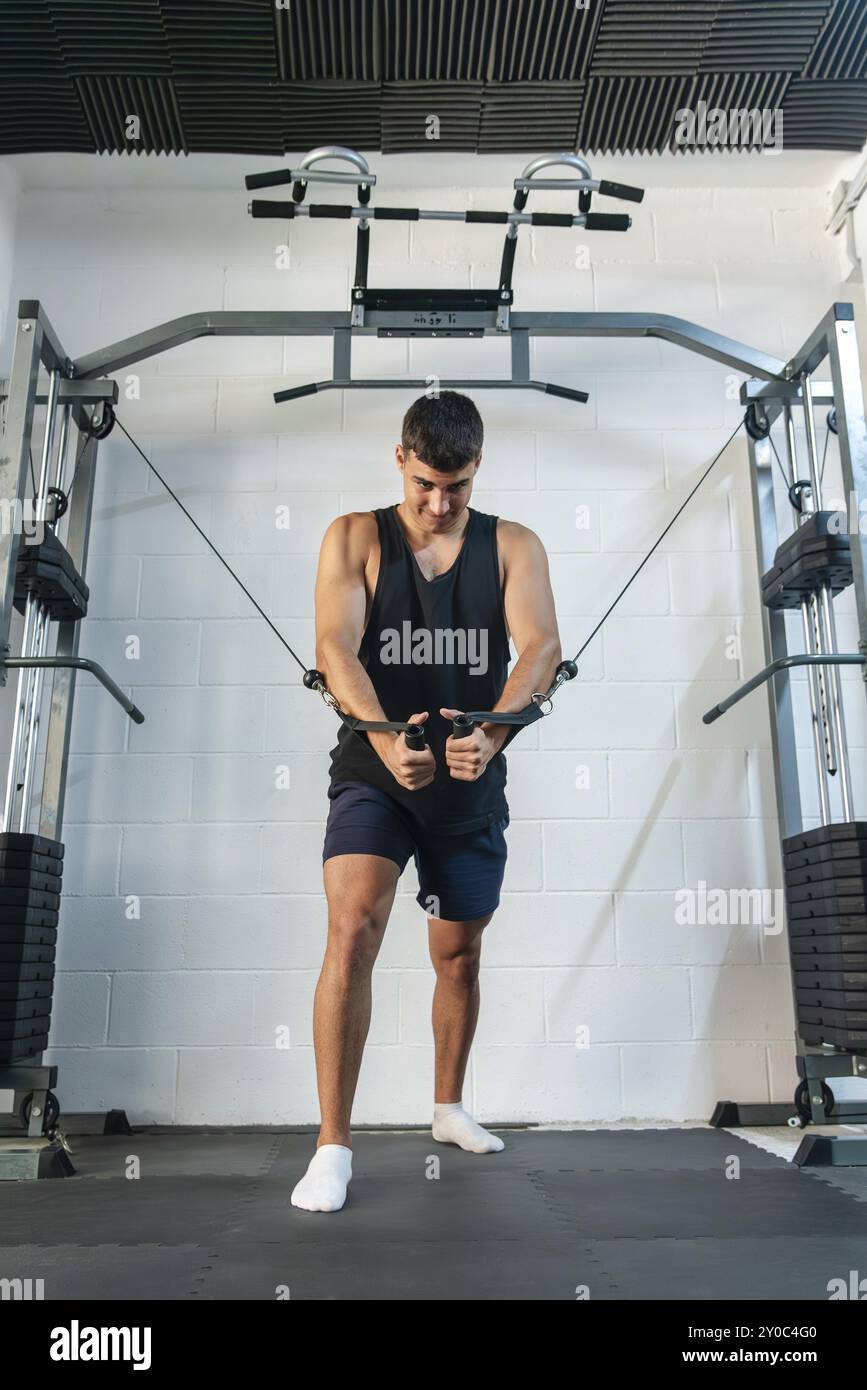 Boy performing weights on an exercise bench exerting great force Stock ...