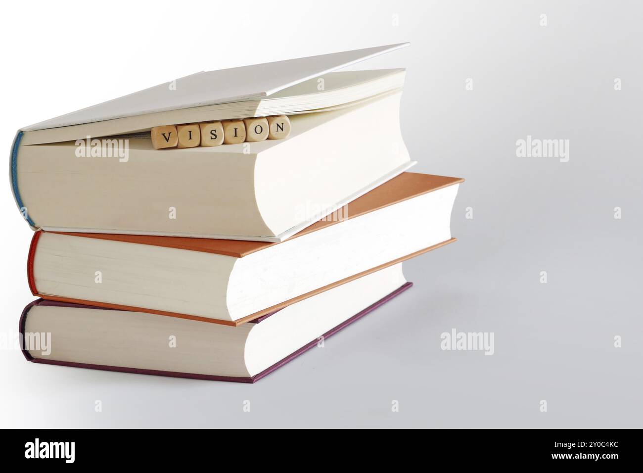 Stack of three books with message Stock Photo - Alamy