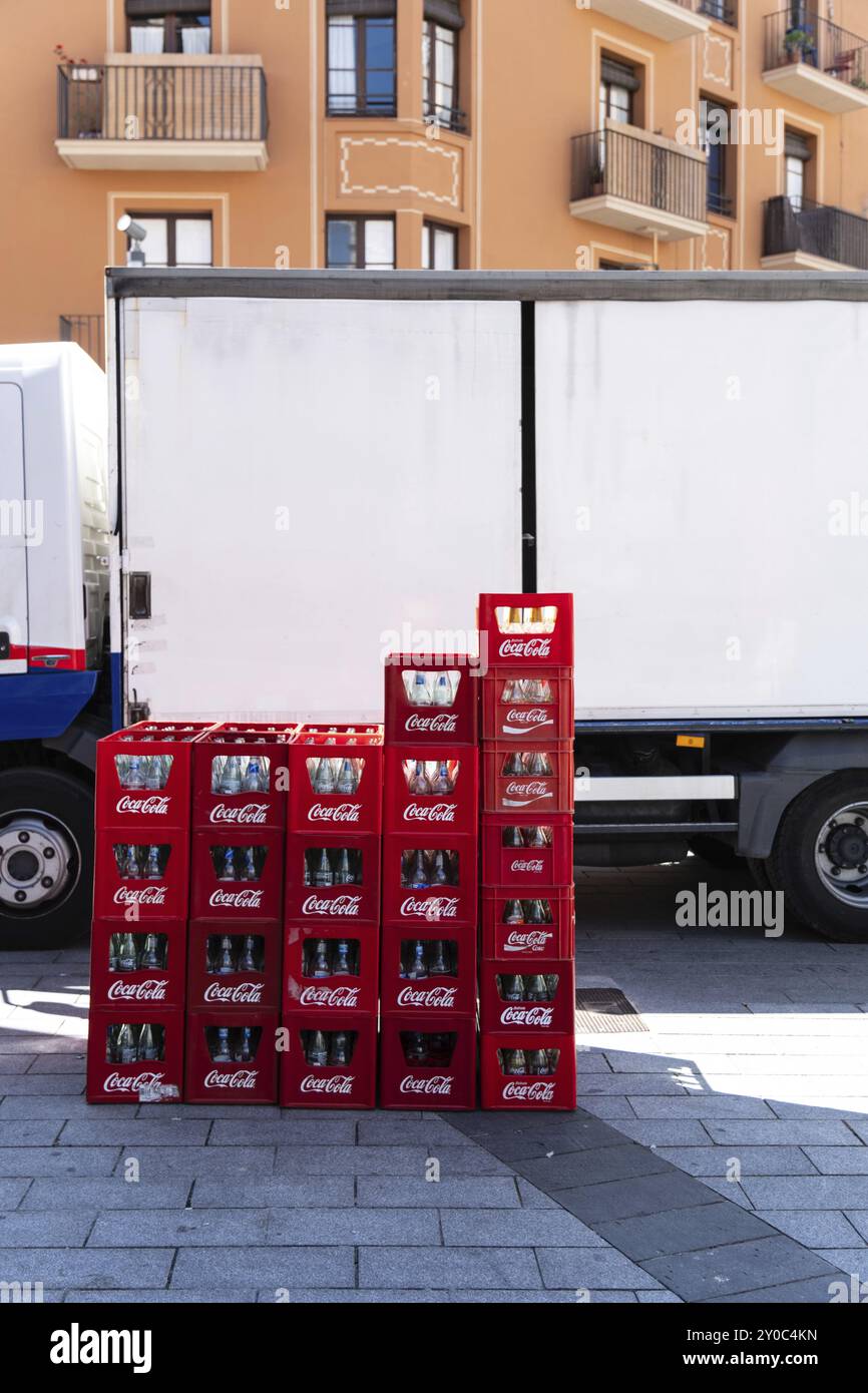Many Coca Cola crates in front of a delivery van in Tarragona, Spain ...
