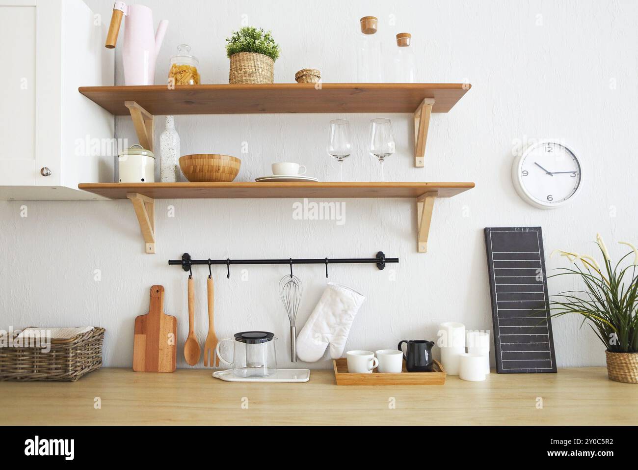 Interior of empty modern white kitchen with various objects on the ...