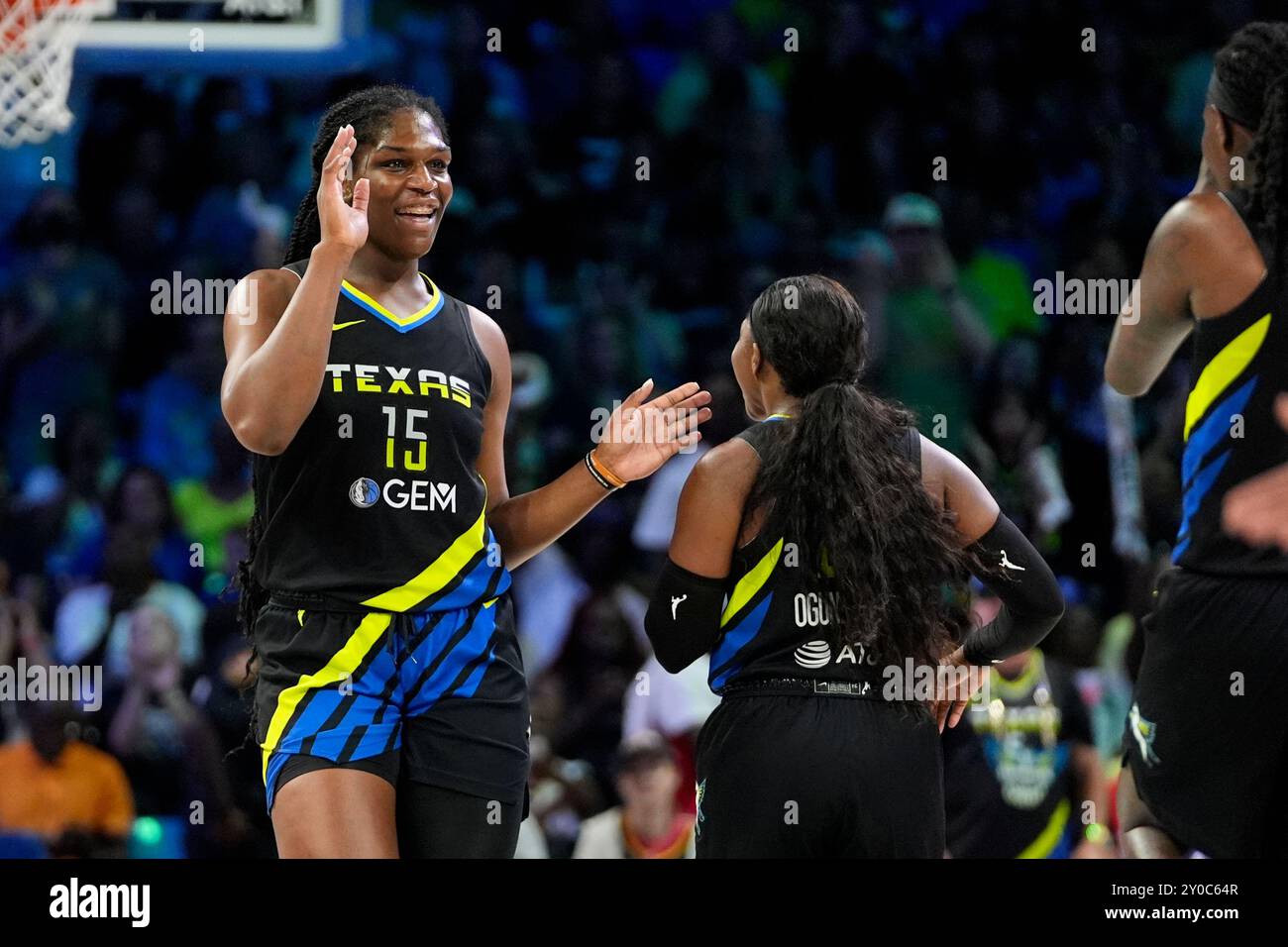 Dallas Wings' Teaira McCowan (15) celebrates with teammates during a ...
