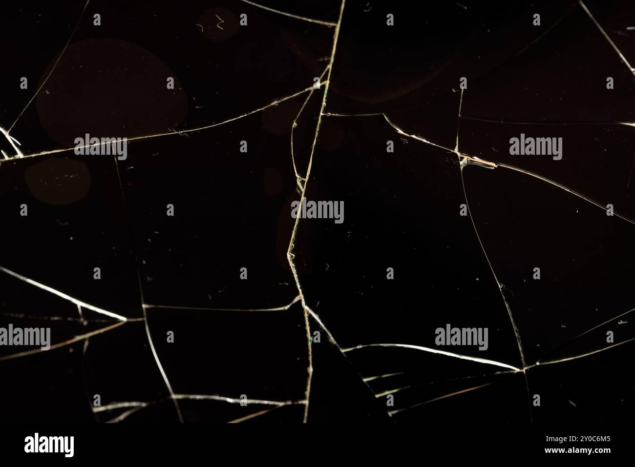 Dirty glass broken into a large number of pieces and parts, a piece of ...