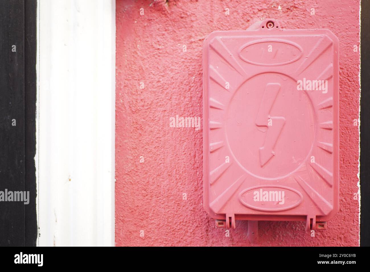 electrical boxes with lightning bolt on brick wall Stock Photo - Alamy