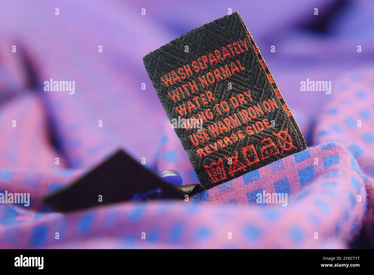 Clothing label with care symbols on a cloth Stock Photo - Alamy