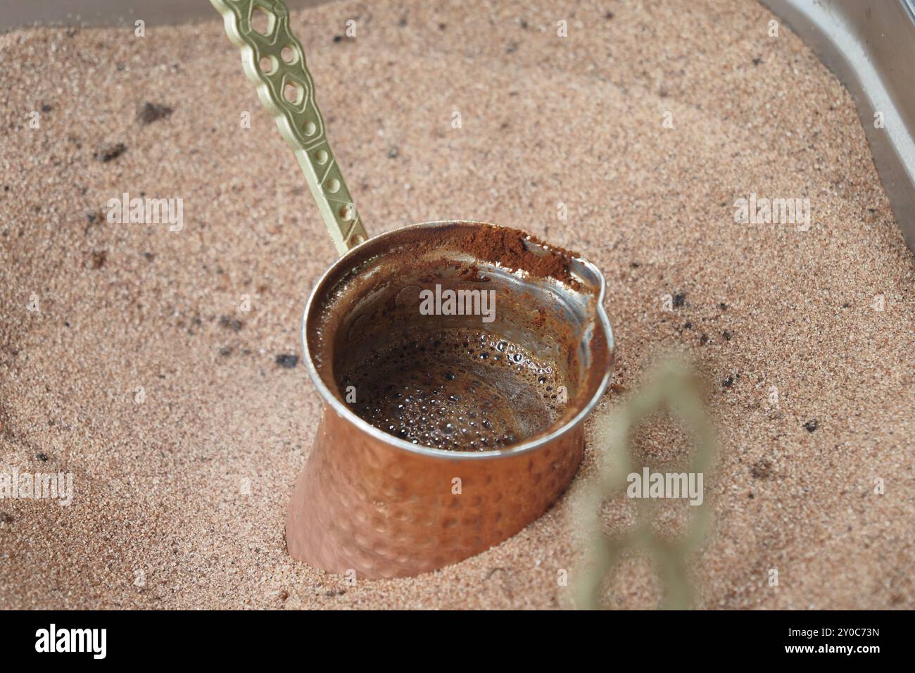 top view of making traditional turkish coffee on sand Stock Photo - Alamy