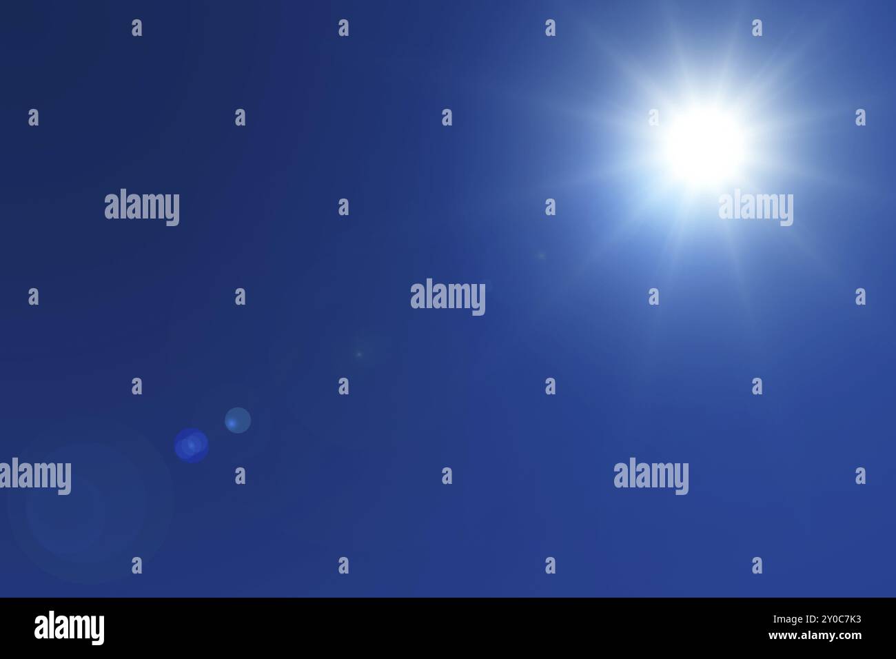 Sun with glare spots in a blue sky Stock Photo - Alamy