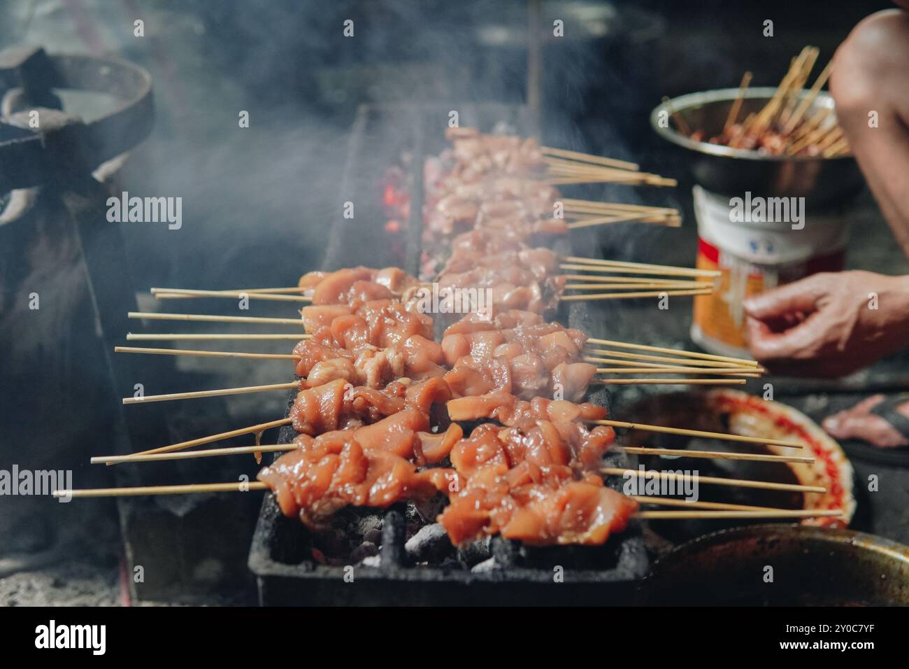 The process of making Indonesian chicken satay in traditional way using ...