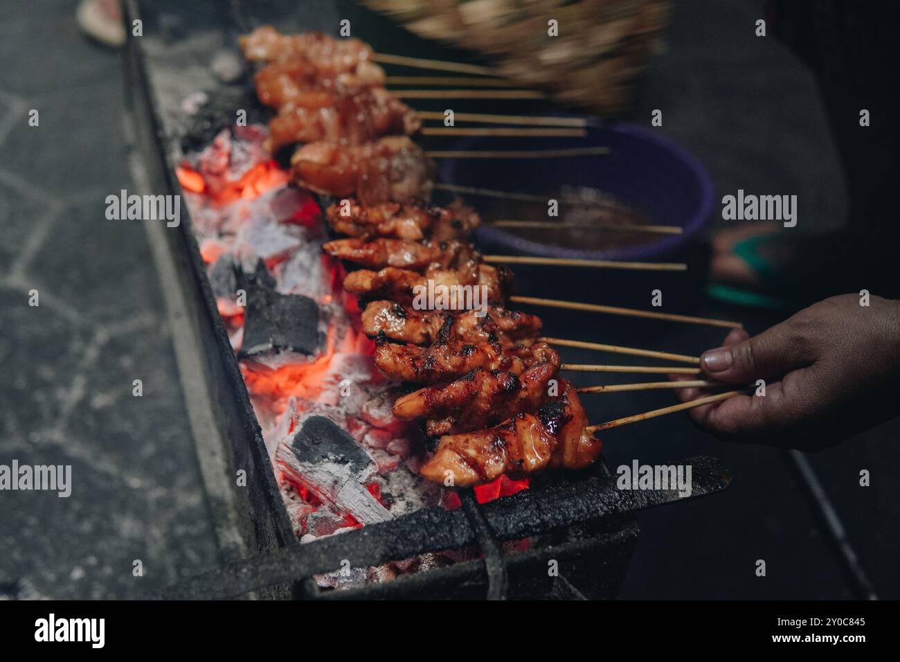 The process of making Indonesian chicken satay in traditional way using ...