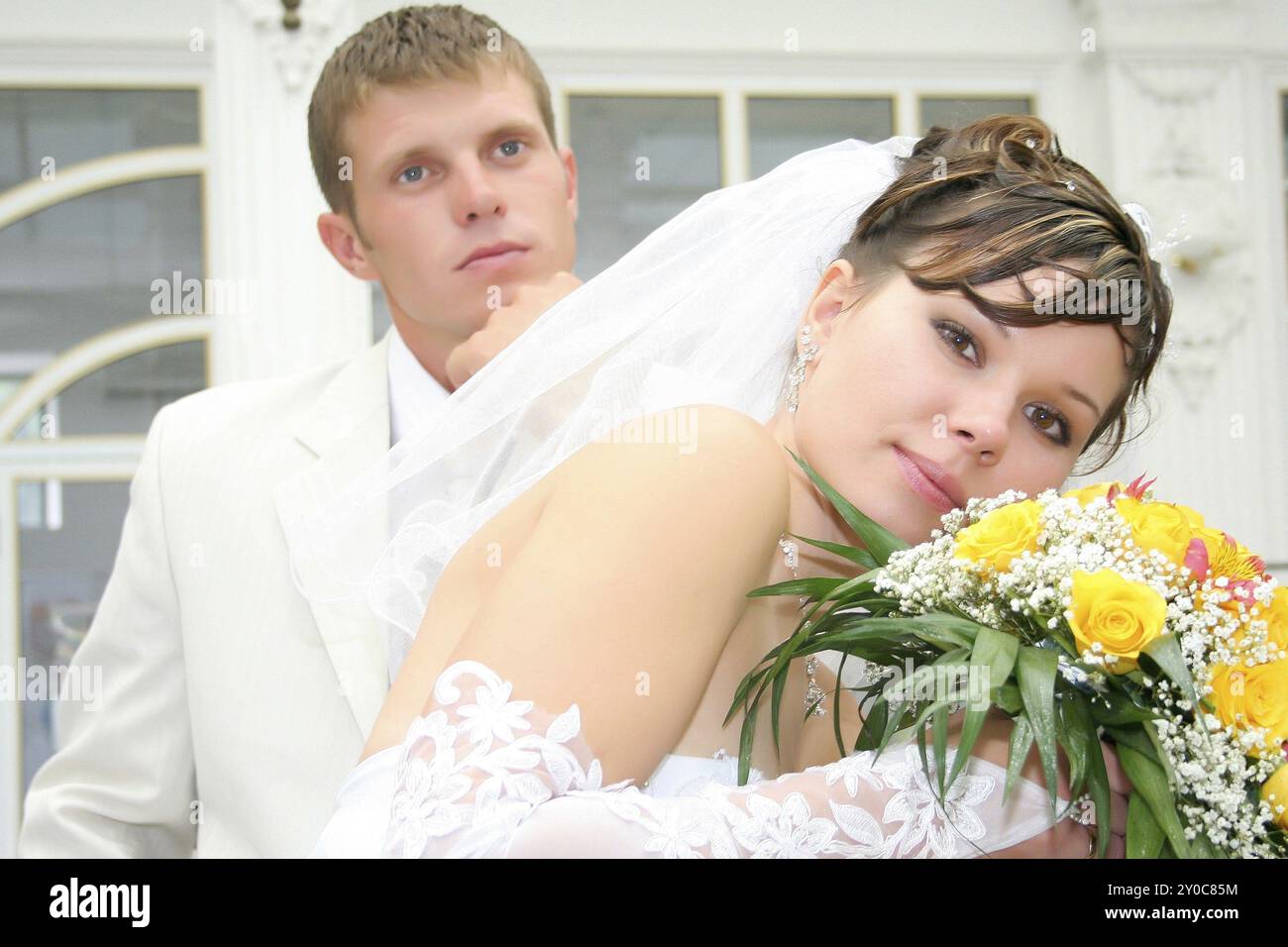 Newly married together in a photo pose Stock Photo - Alamy