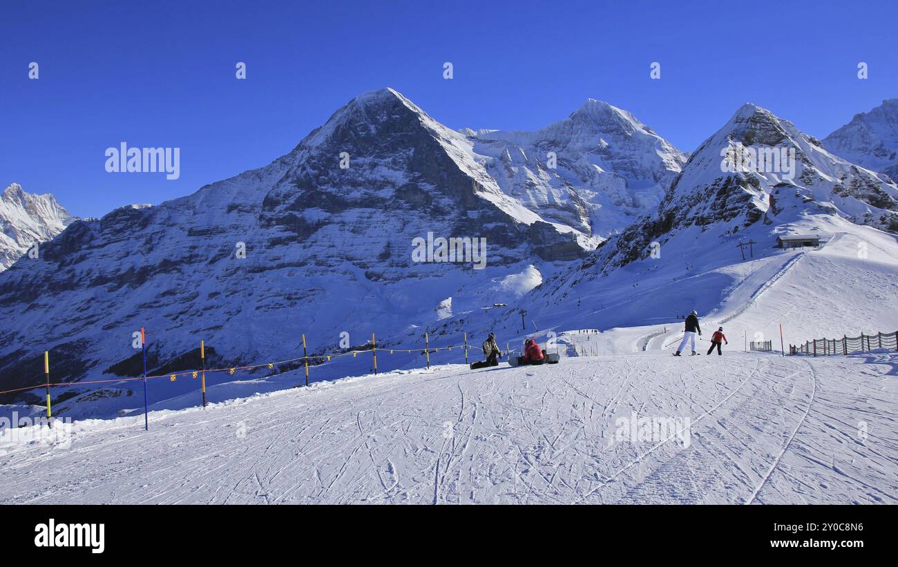 Ski slope and snow covered mountains Eiger, Monch and Lauberhorn ...