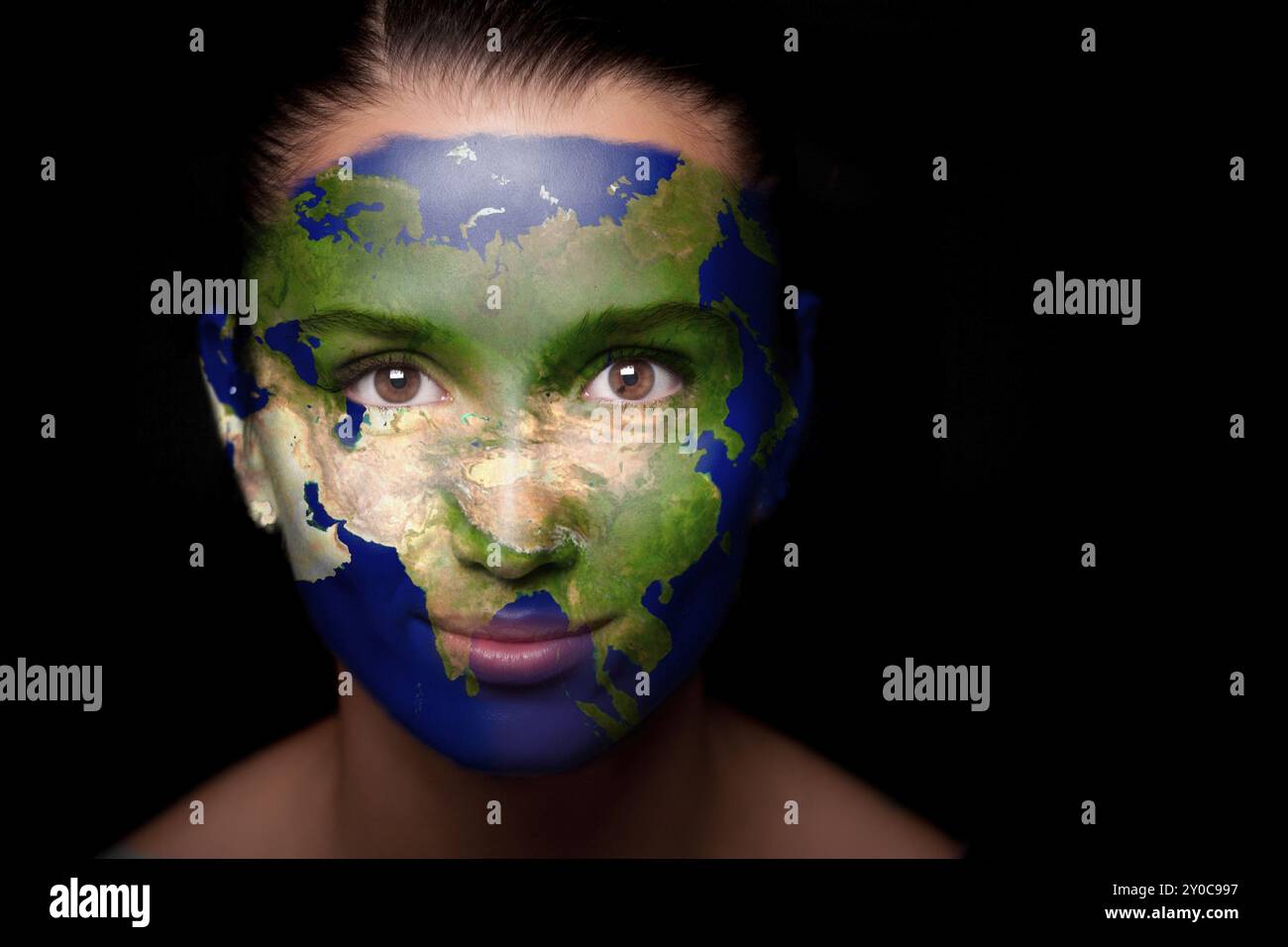 Girl with a painted map of Asia on his face. Closeup Stock Photo - Alamy