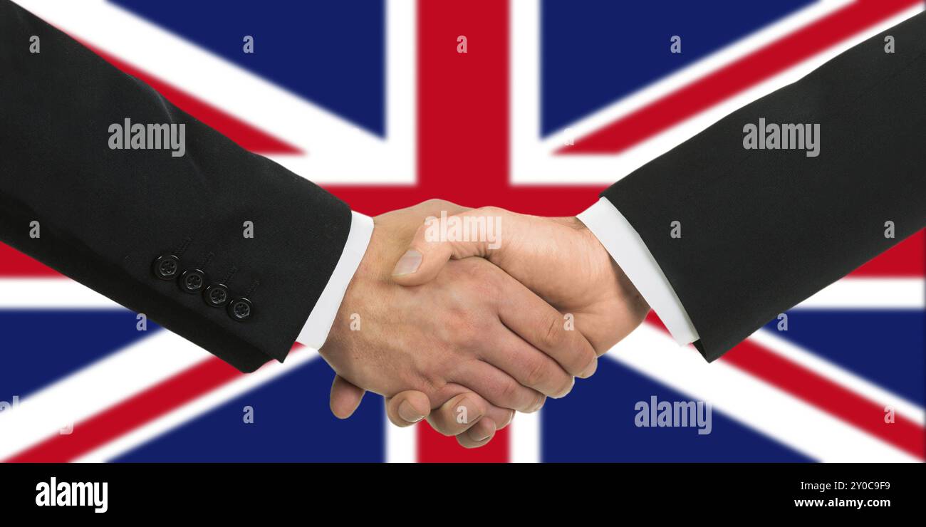 The British flag and business handshake Stock Photo - Alamy