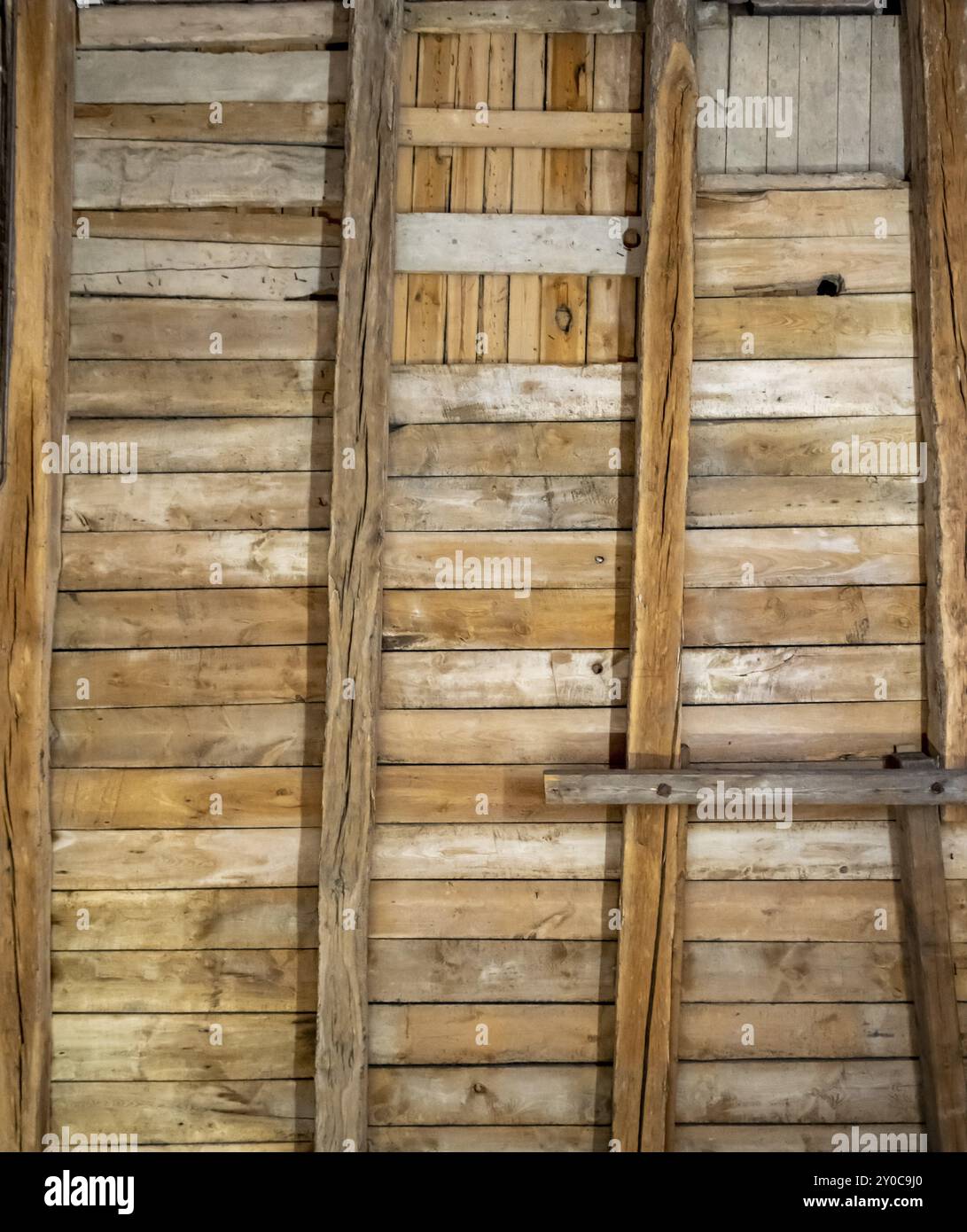 Old brown wall made of boards and thick wooden beams as a background ...