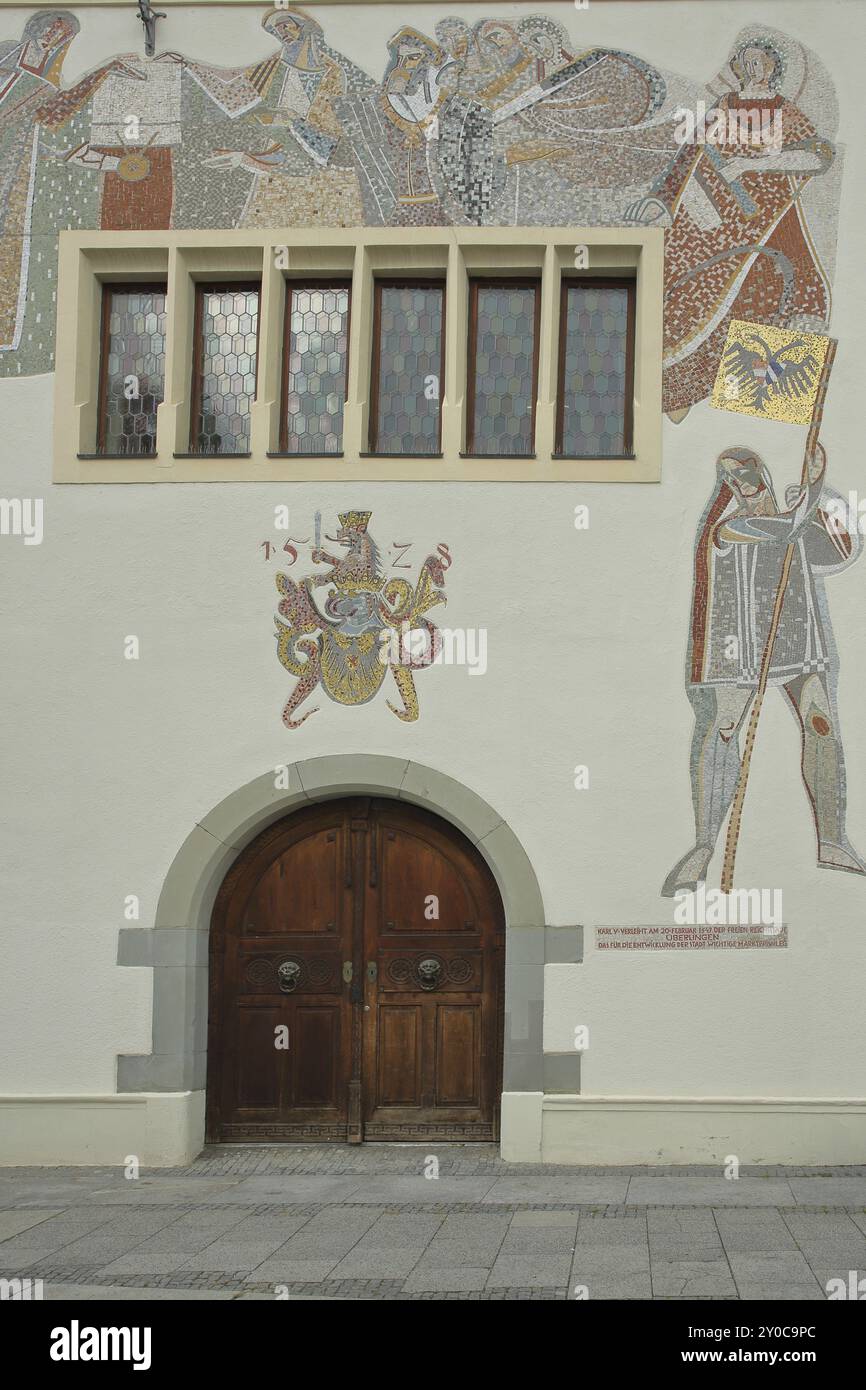 House wall with mural, wooden door, year 1528 and town coat of arms ...