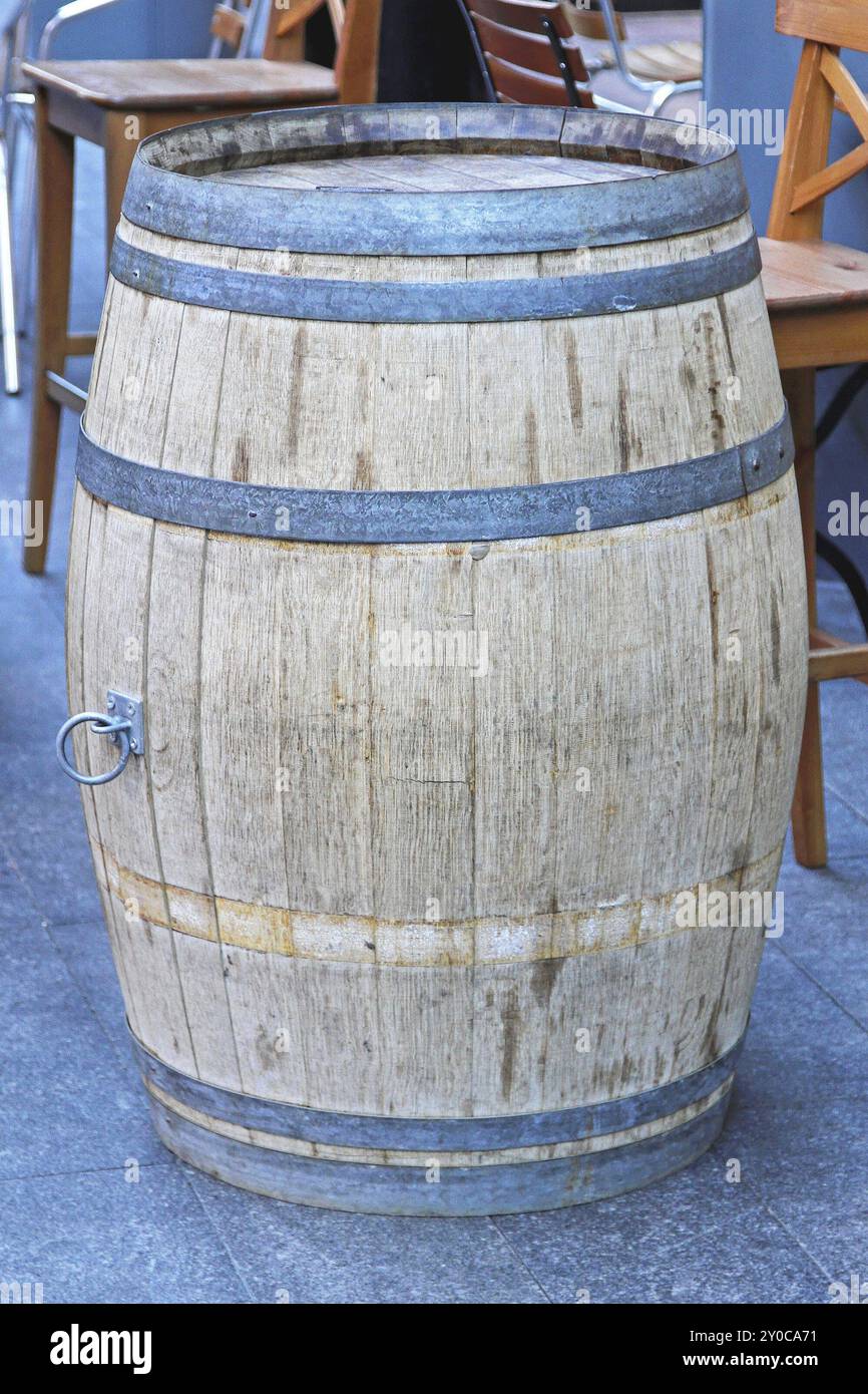 Old oak barrel in front of caffee Stock Photo - Alamy