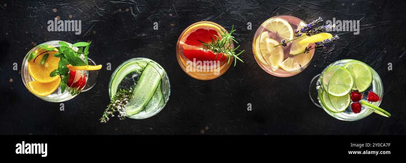 Fancy cocktails with fresh fruit panorama. Gin and tonic drinks with ...