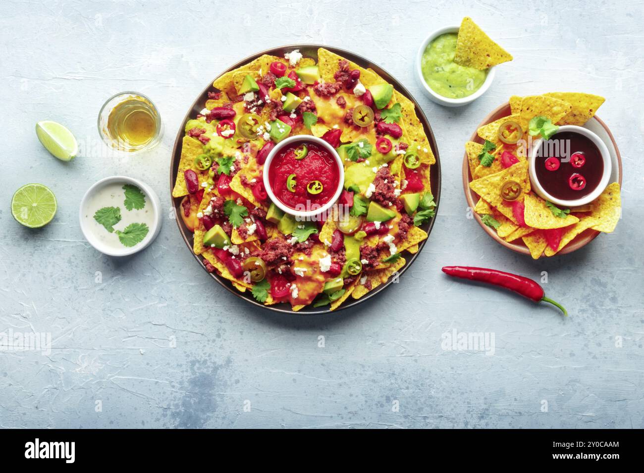 Loaded nachos. Mexican nacho chips with beef, overhead flat lay shot ...