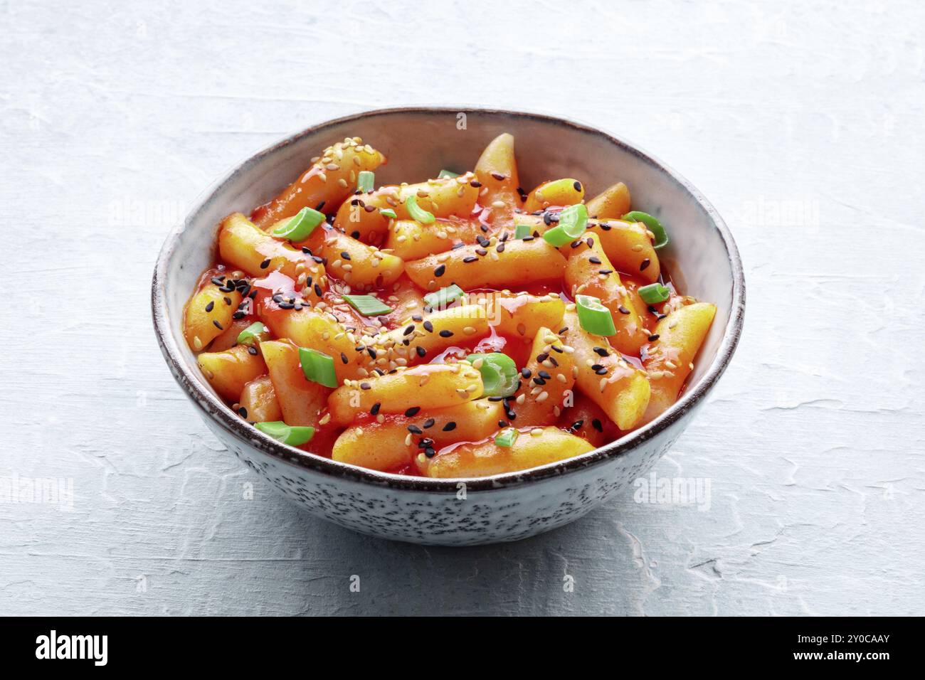 Tteokbokki or topokki, Korean street food, spicy rice cakes in red ...